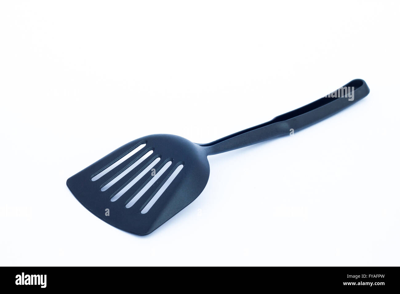Black plastic kitchen spatula on white background, stock photo Stock ...