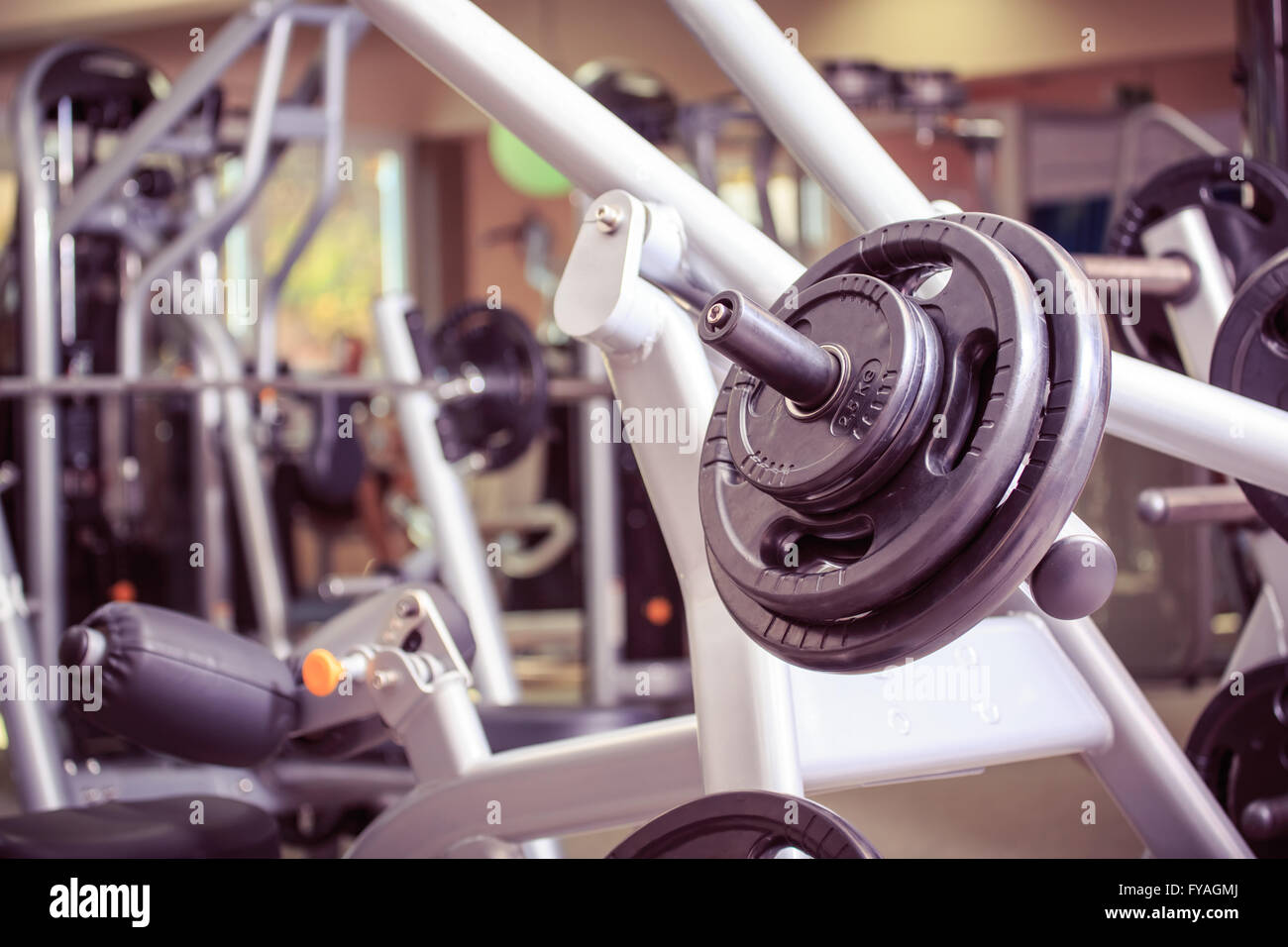 diverse equipment and machines at the gym room Stock Photo - Alamy