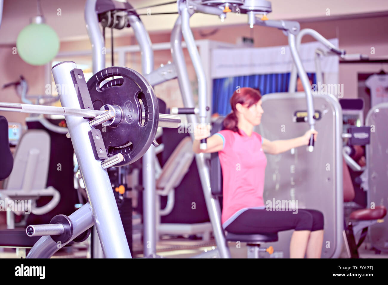 diverse equipment and machines at the gym room Stock Photo - Alamy