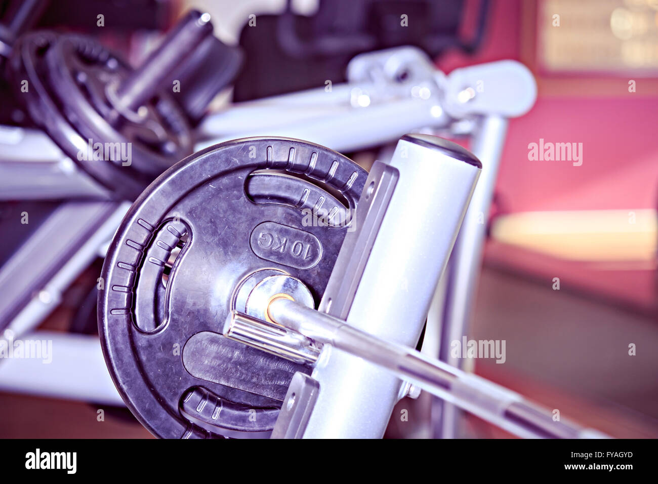 diverse equipment and machines at the gym room Stock Photo - Alamy