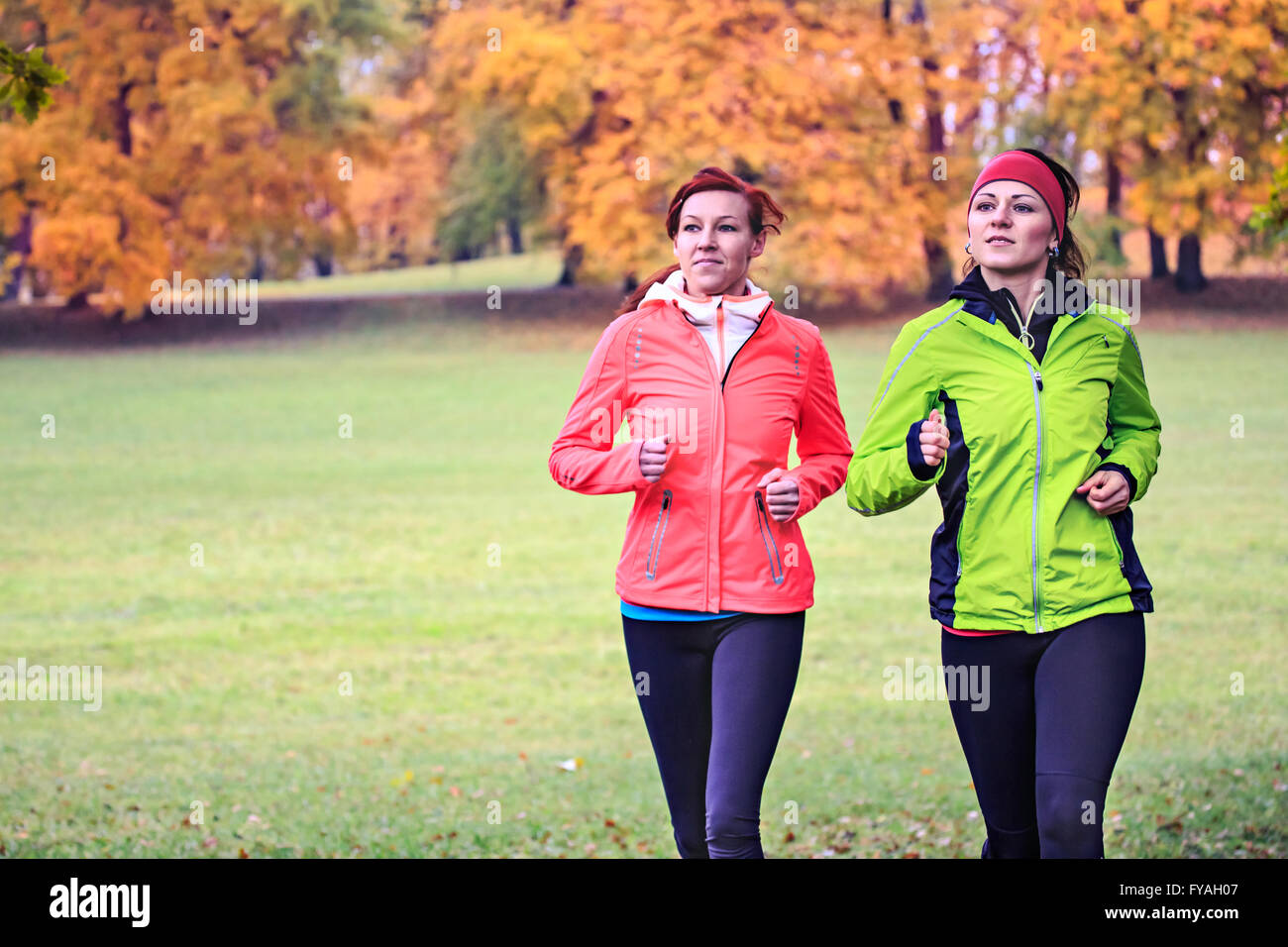a women jogging in an autumn park Stock Photo - Alamy