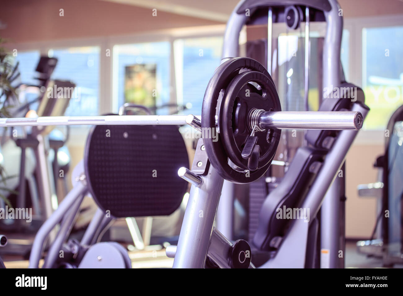 diverse equipment and machines at the gym room Stock Photo - Alamy