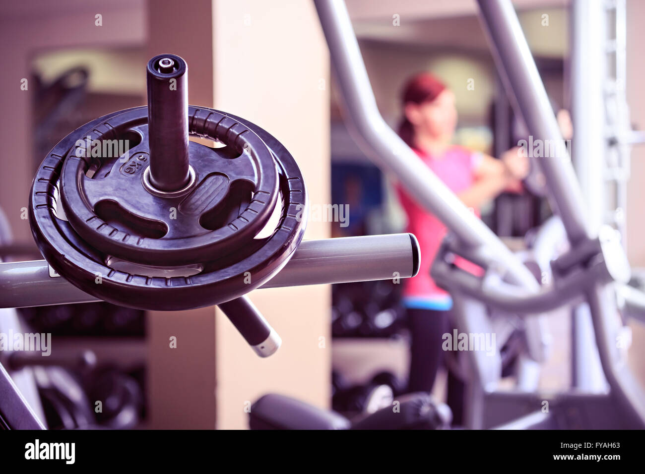 diverse equipment and machines at the gym room Stock Photo - Alamy