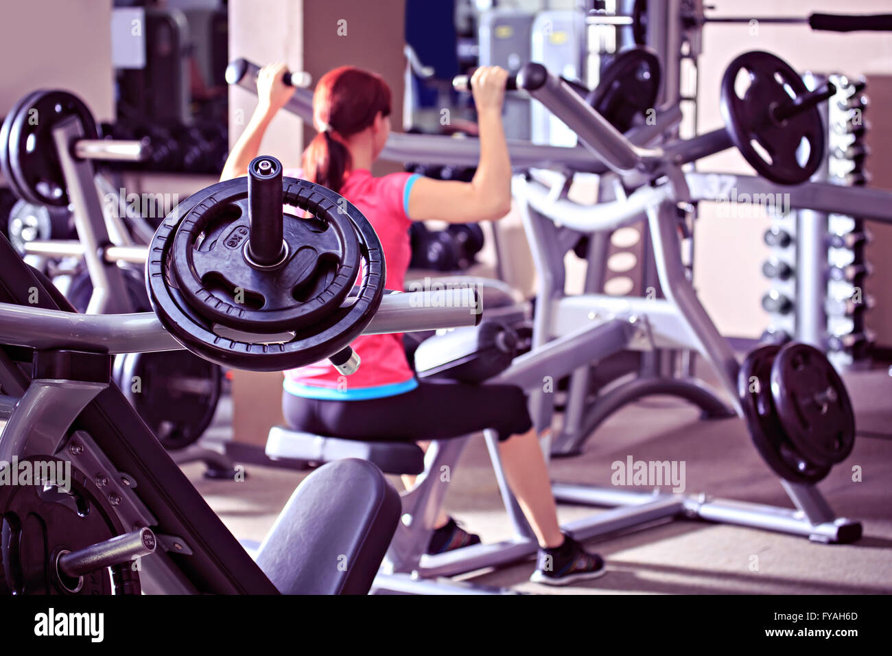 diverse equipment and machines at the gym room Stock Photo - Alamy