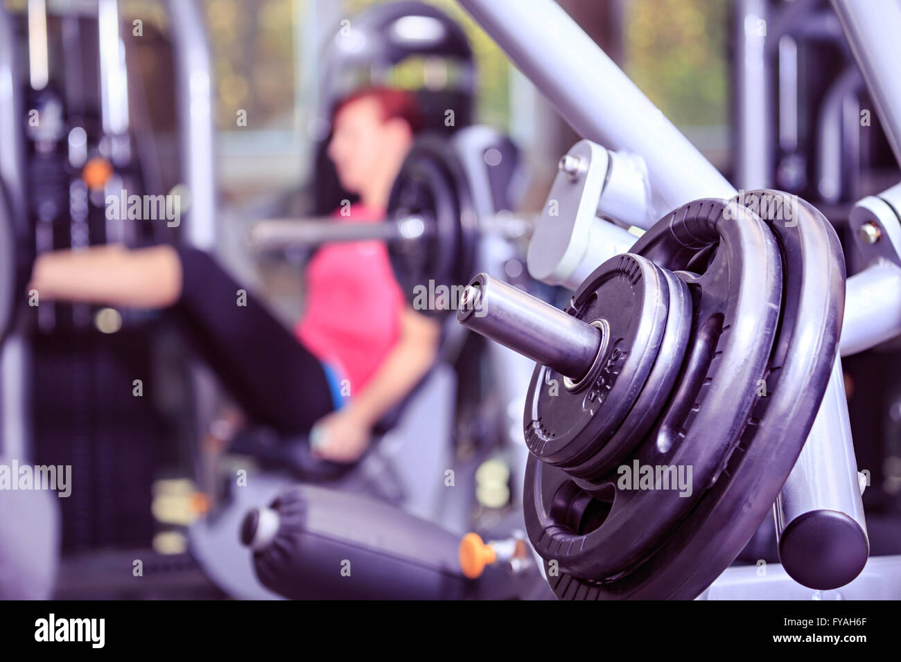 diverse equipment and machines at the gym room Stock Photo - Alamy