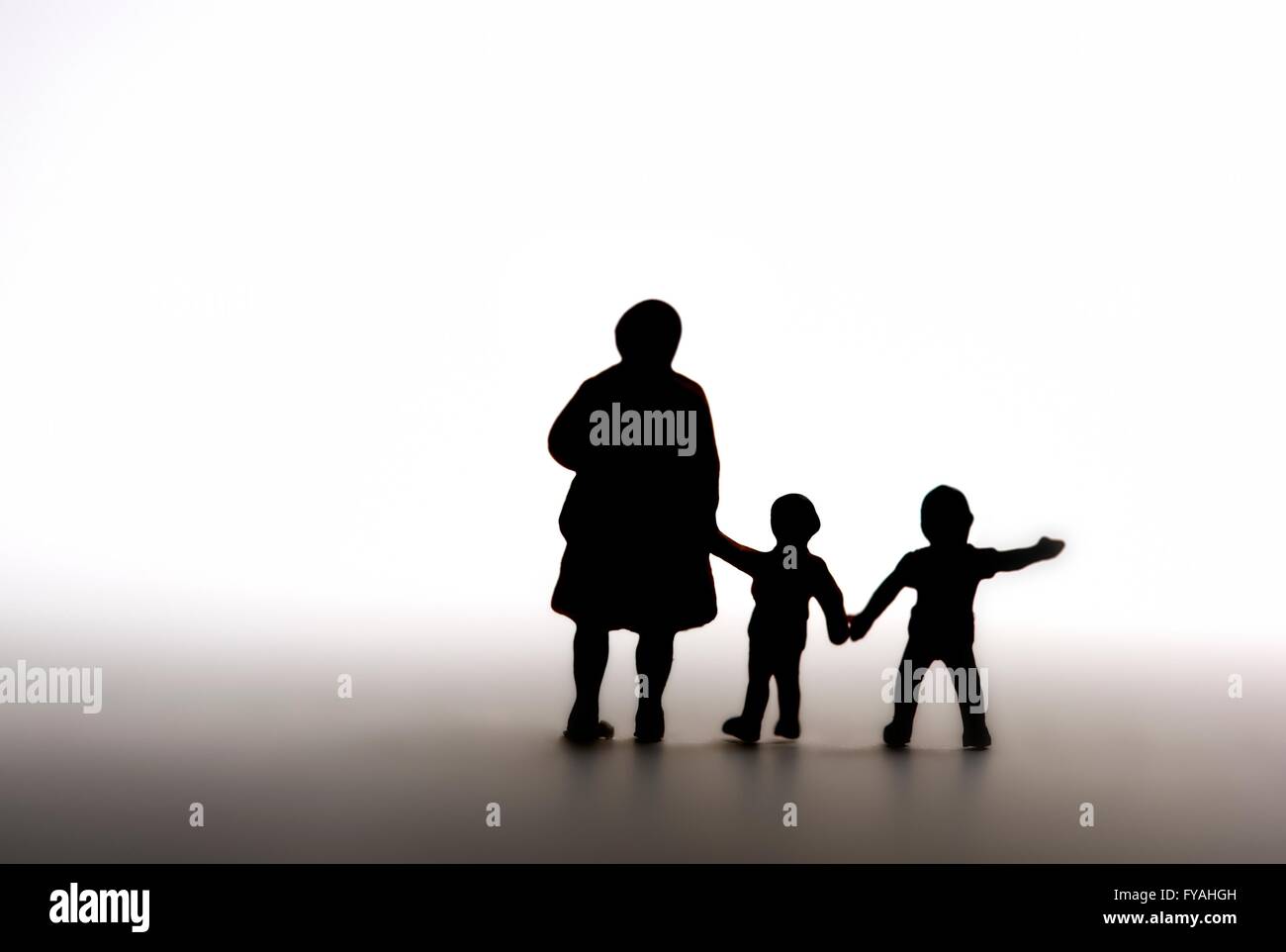 A young infant child silhouette reaching out for help Stock Photo - Alamy