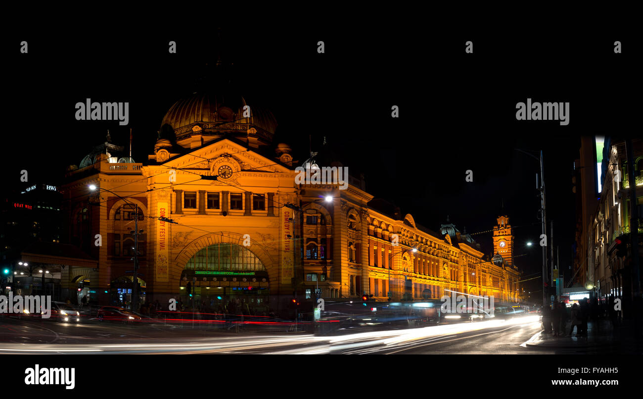 A photo of Flinders street station with lines of lights from moving ...