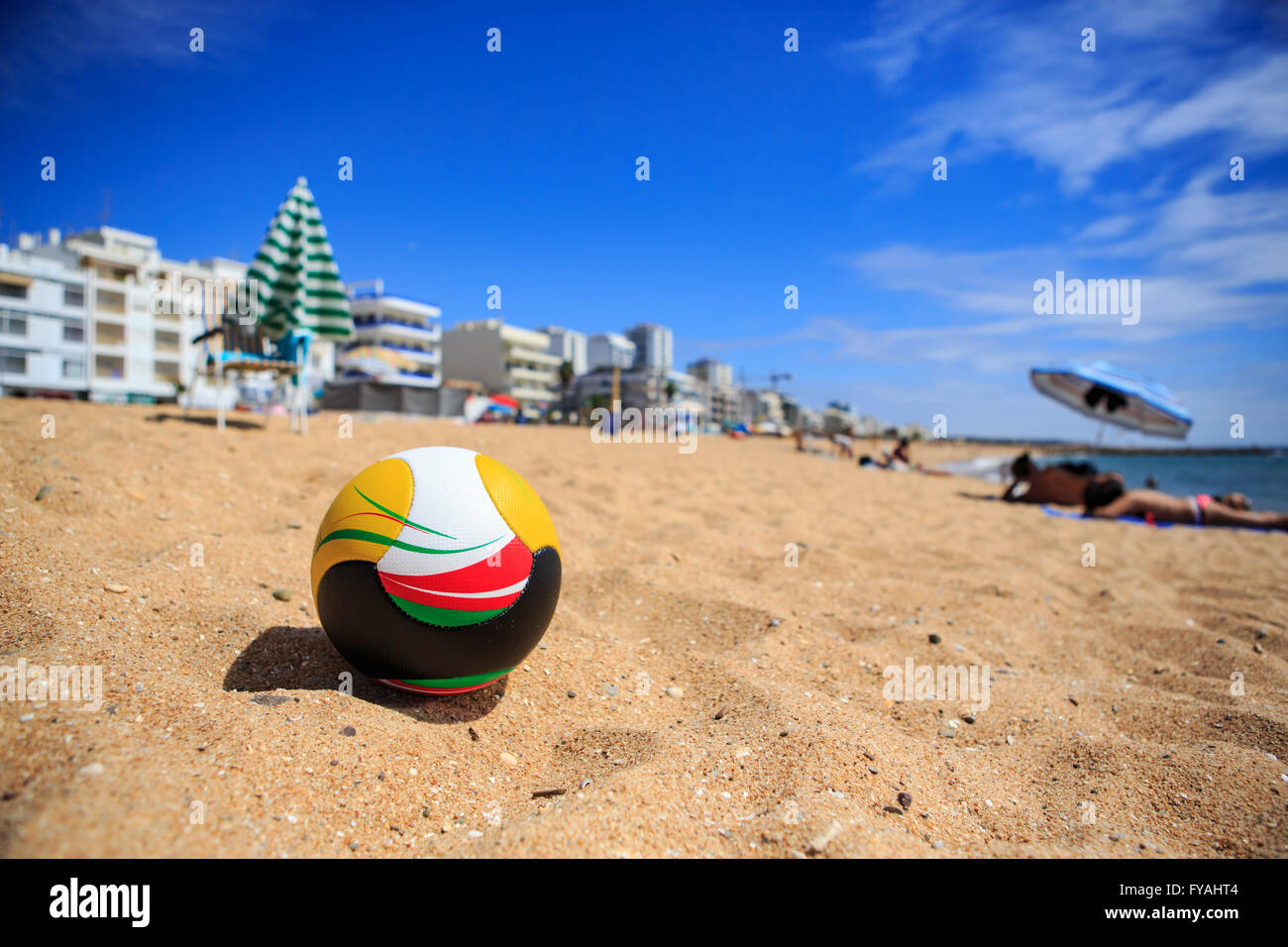 Symbolic picture for vacations with a ball on the beach Stock Photo - Alamy