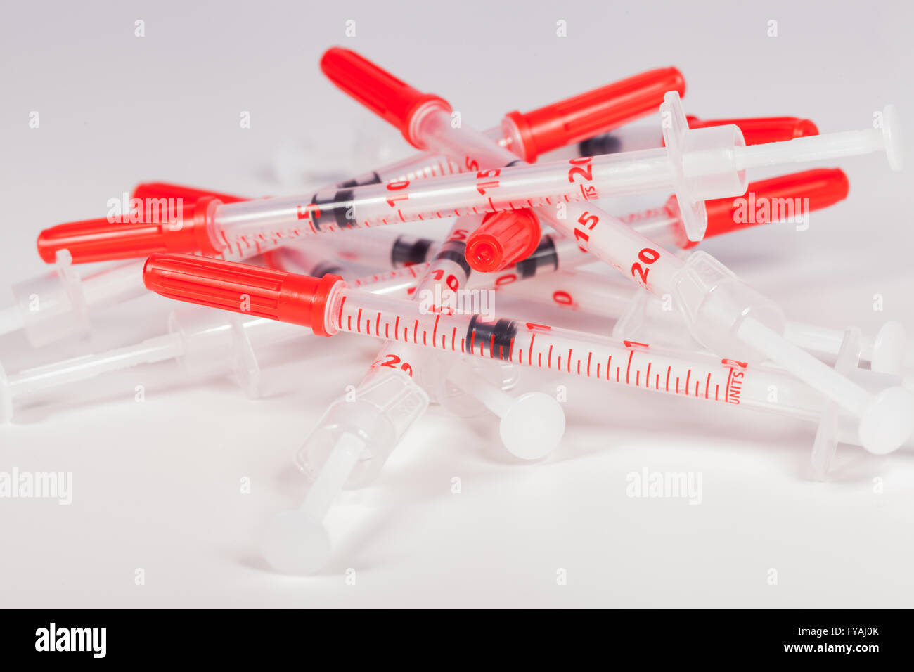 Still Life Close Up of Pile of Empty Syringe Needles with Red Safety ...