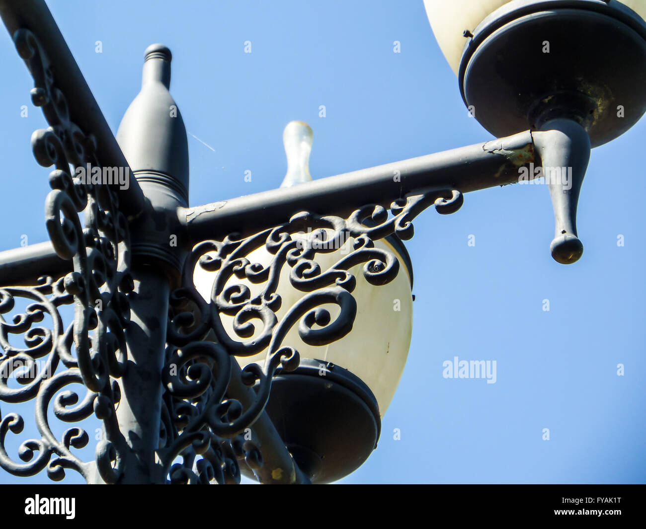 Street light post with four lamps and blue sky background Stock Photo ...
