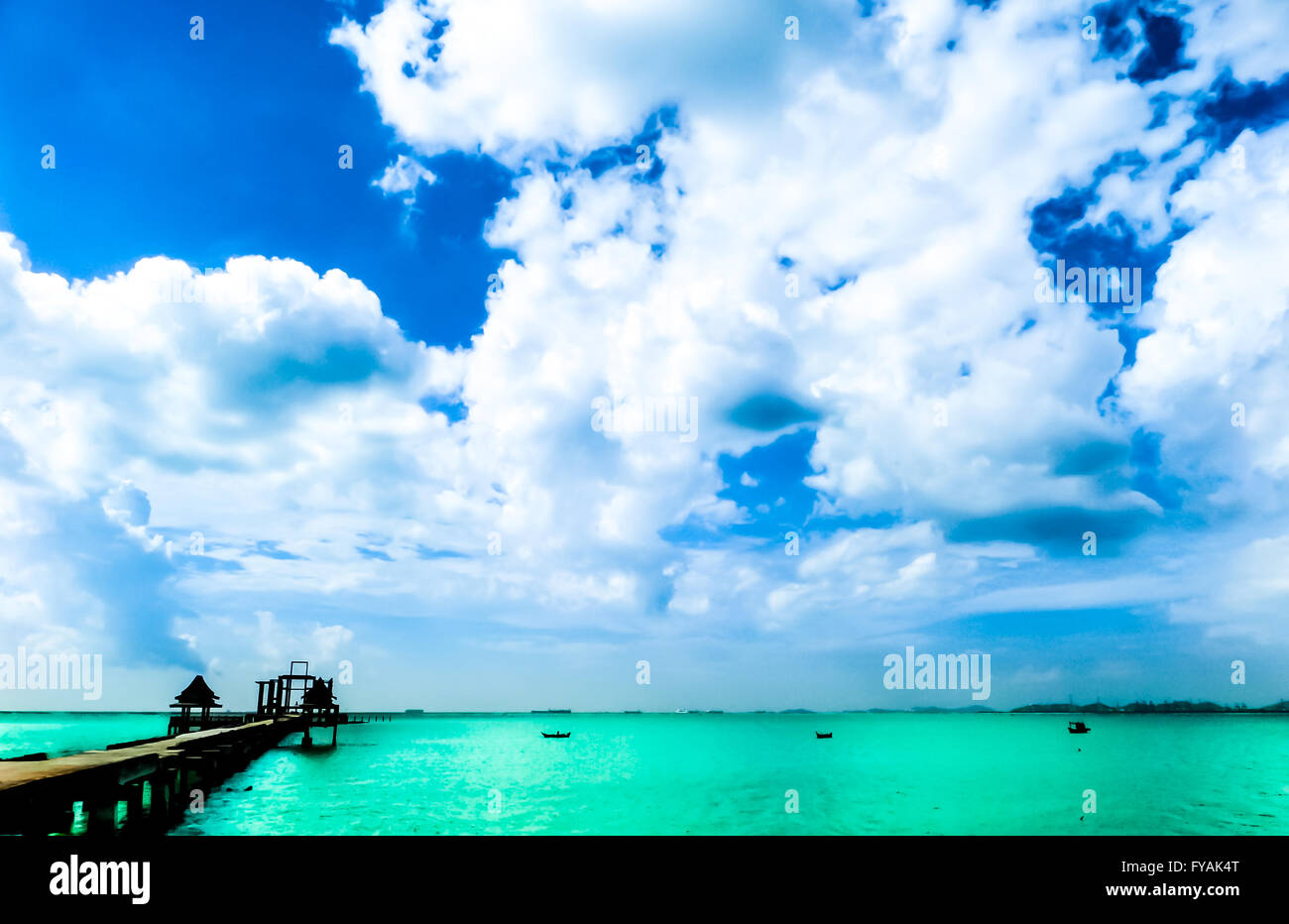 White Cloud bridge on green sea on horizon Stock Photo - Alamy
