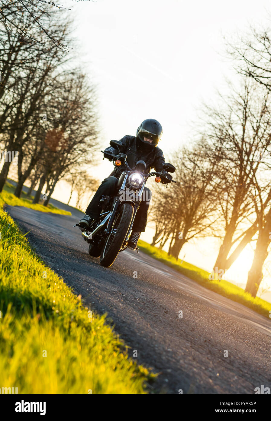 Young man driving chopper Stock Photo - Alamy