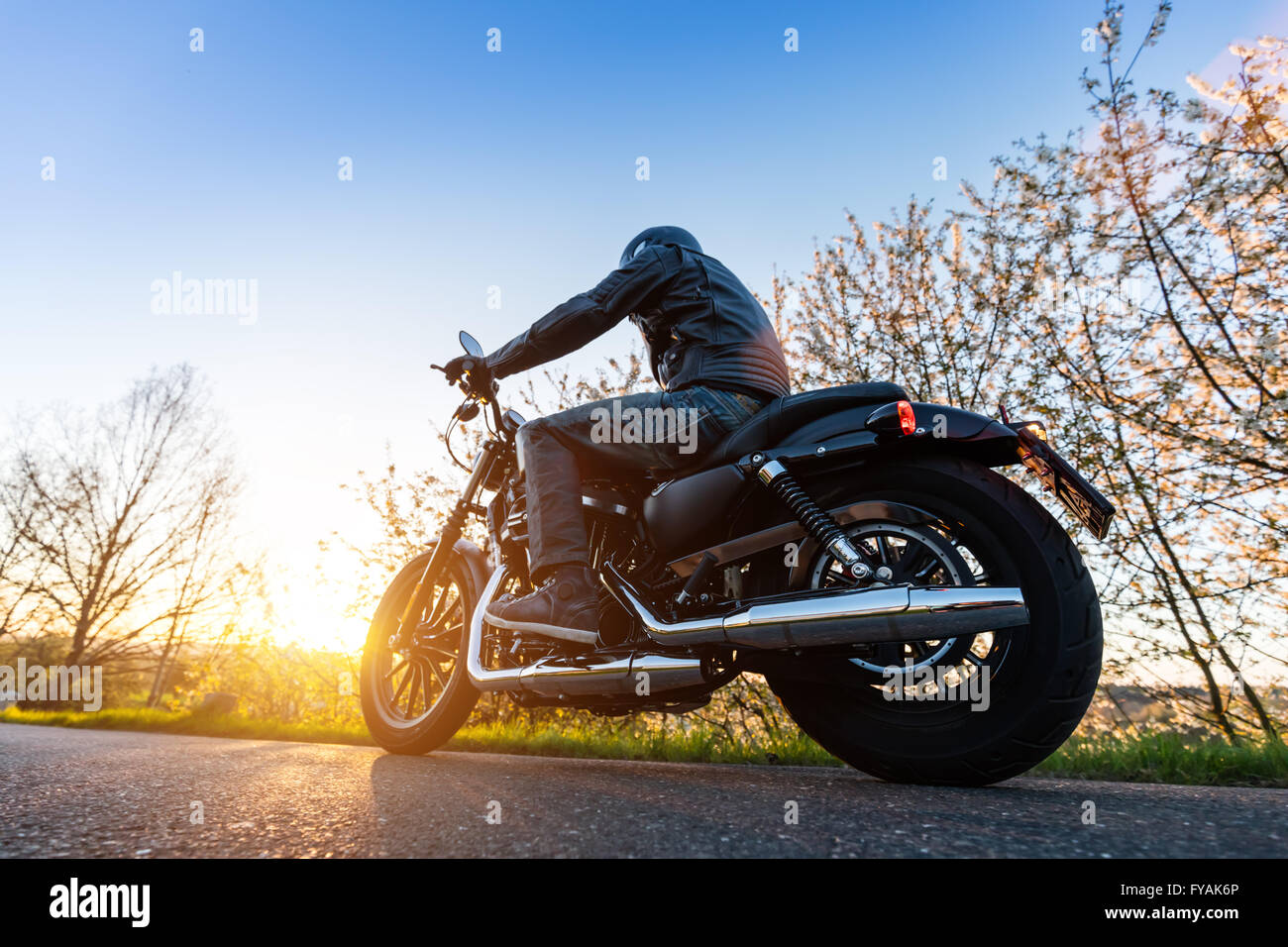 Young man driving chopper Stock Photo - Alamy