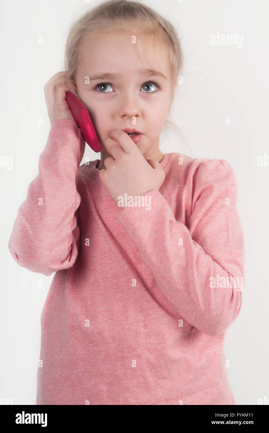 Little girl talking on cellphone Stock Photo - Alamy