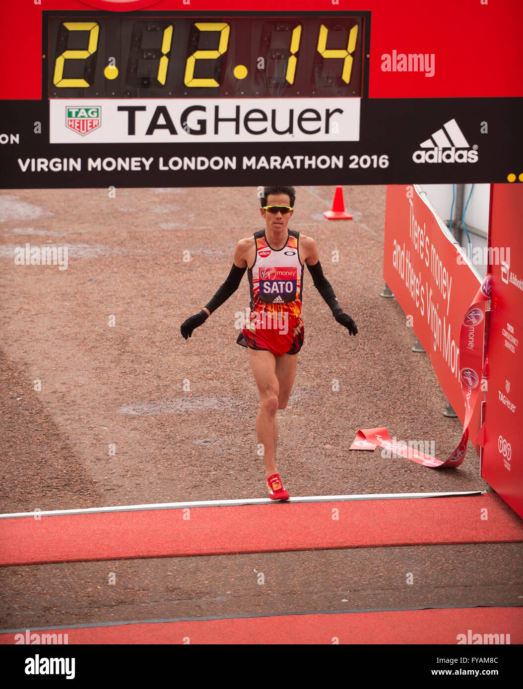Yuki Sato of Japan crosses the finish line of the 2016 Virgin Money ...