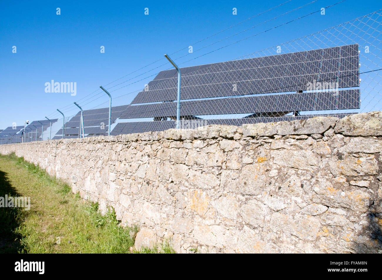 Solar panels behind wire fence. Solar energy production plant. Toledo ...