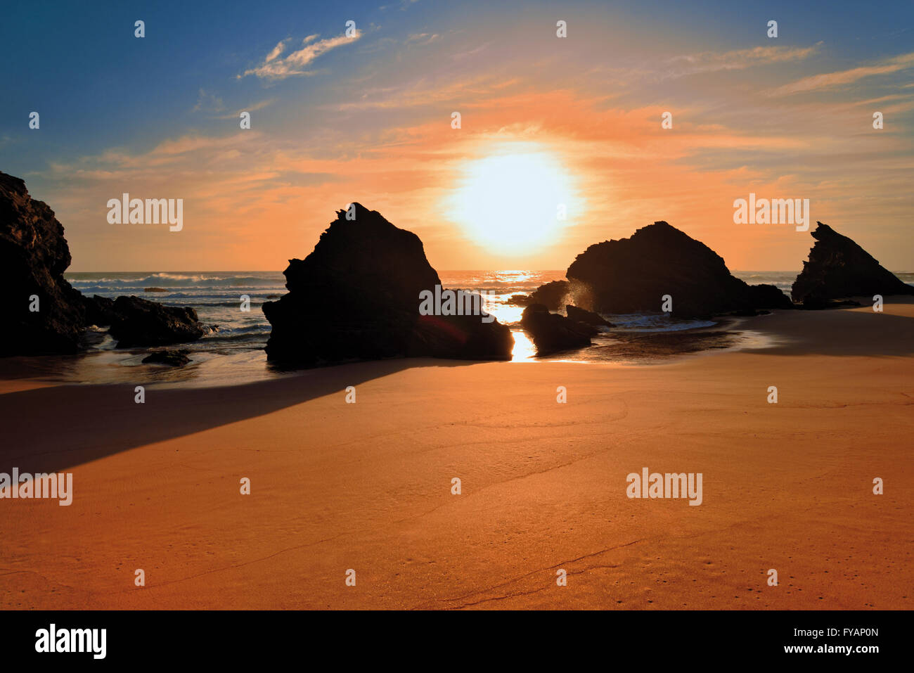 Portugal, Algarve: Scenic sunset with rocks at beach Praia de Odeceixe ...