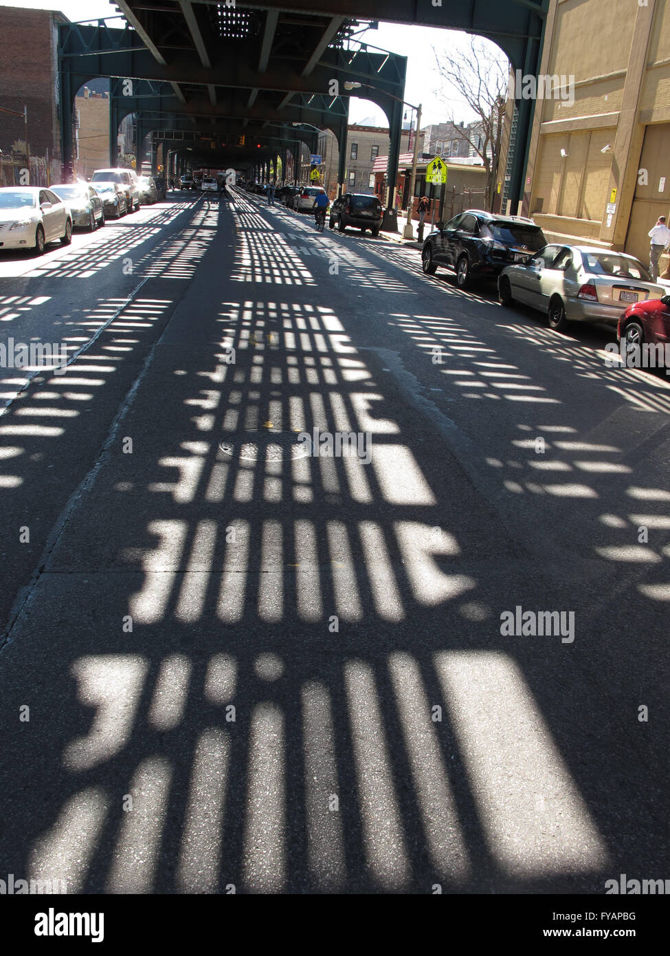steel structure of elevated subway casts shadow on 23rd Street in Long ...