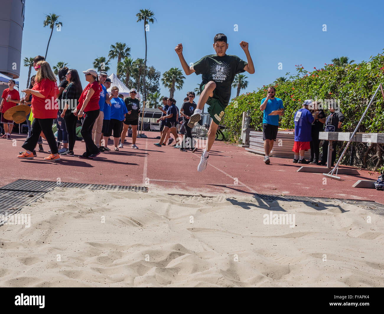 A disabled teenage boy jumps in the broad jump at the Southern ...