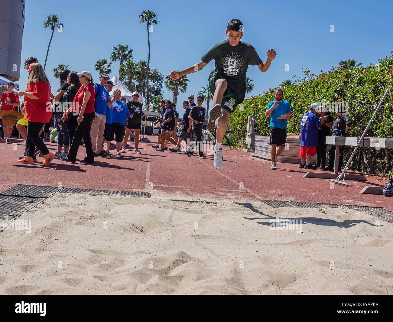 A disabled teenage boy jumps in the broad jump at the Southern ...