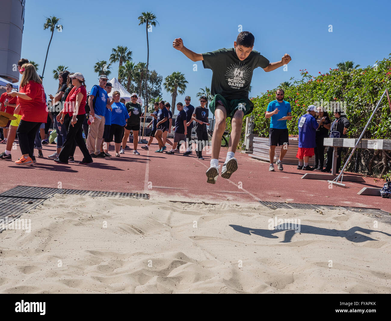 A disabled teenage boy jumps in the broad jump at the Southern ...