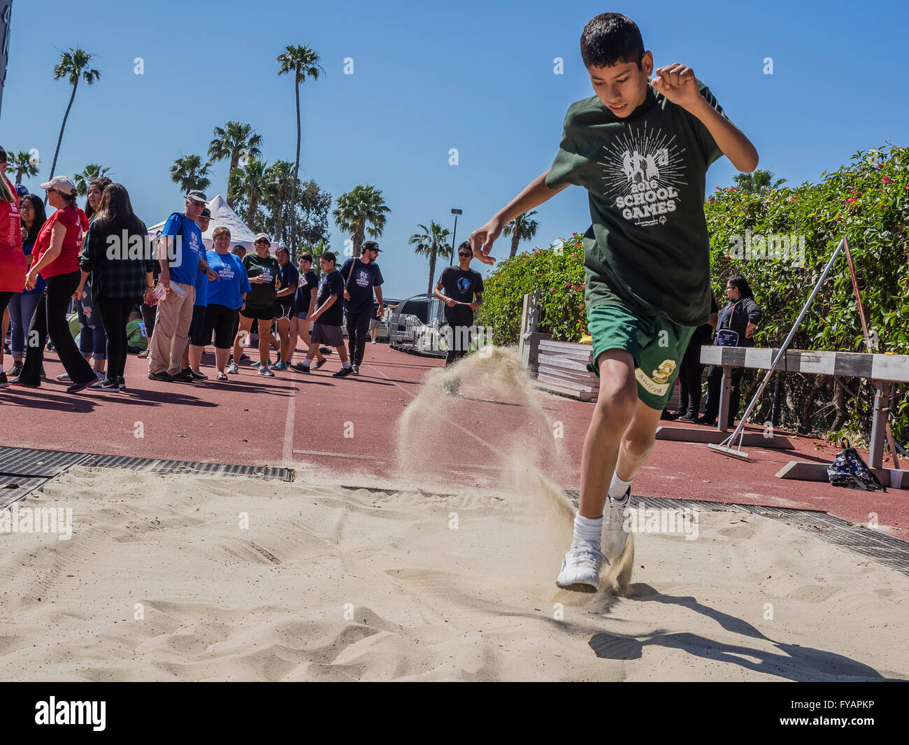 A disabled teenage boy jumps in the broad jump at the Southern ...