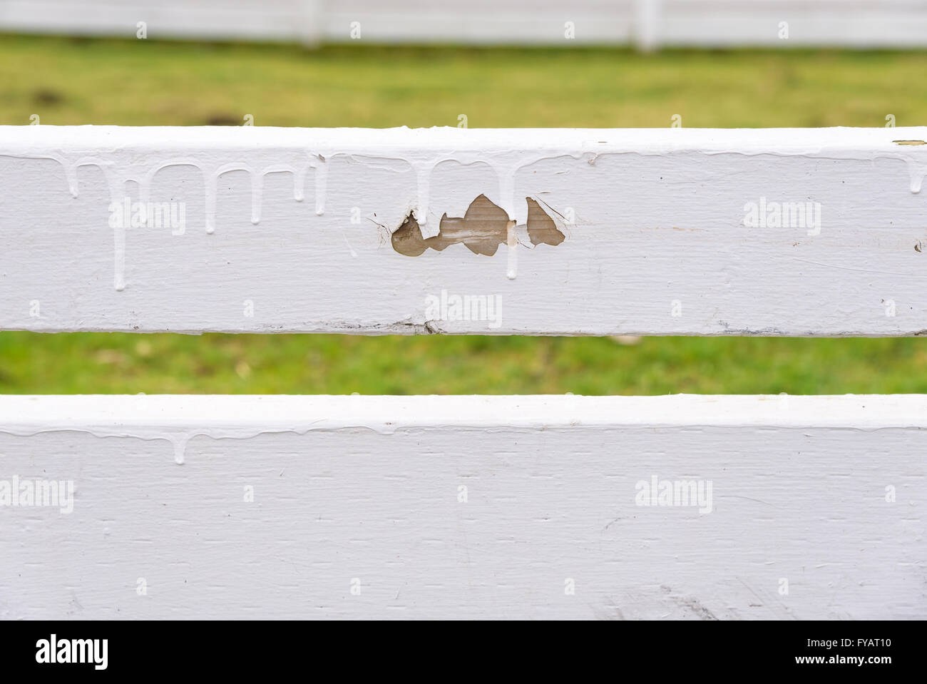 Poorly painted white fence, with paint drips and chipped Stock Photo ...