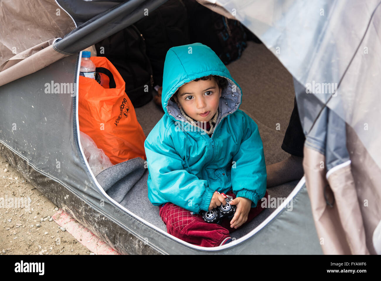 A boy plays in his tent on March 17, 2015 in the refugee camp of ...