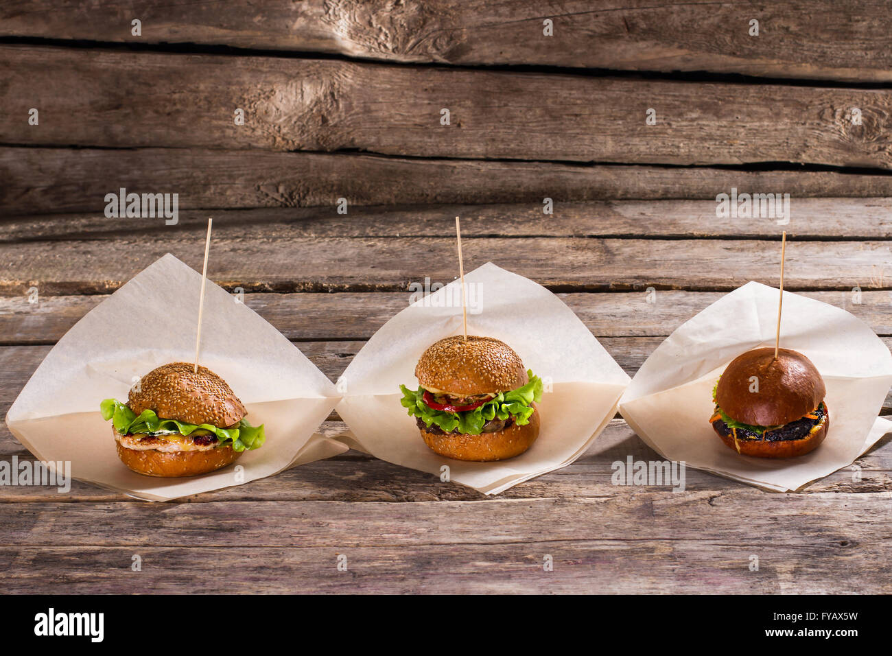 Different burgers on sticks Stock Photo - Alamy