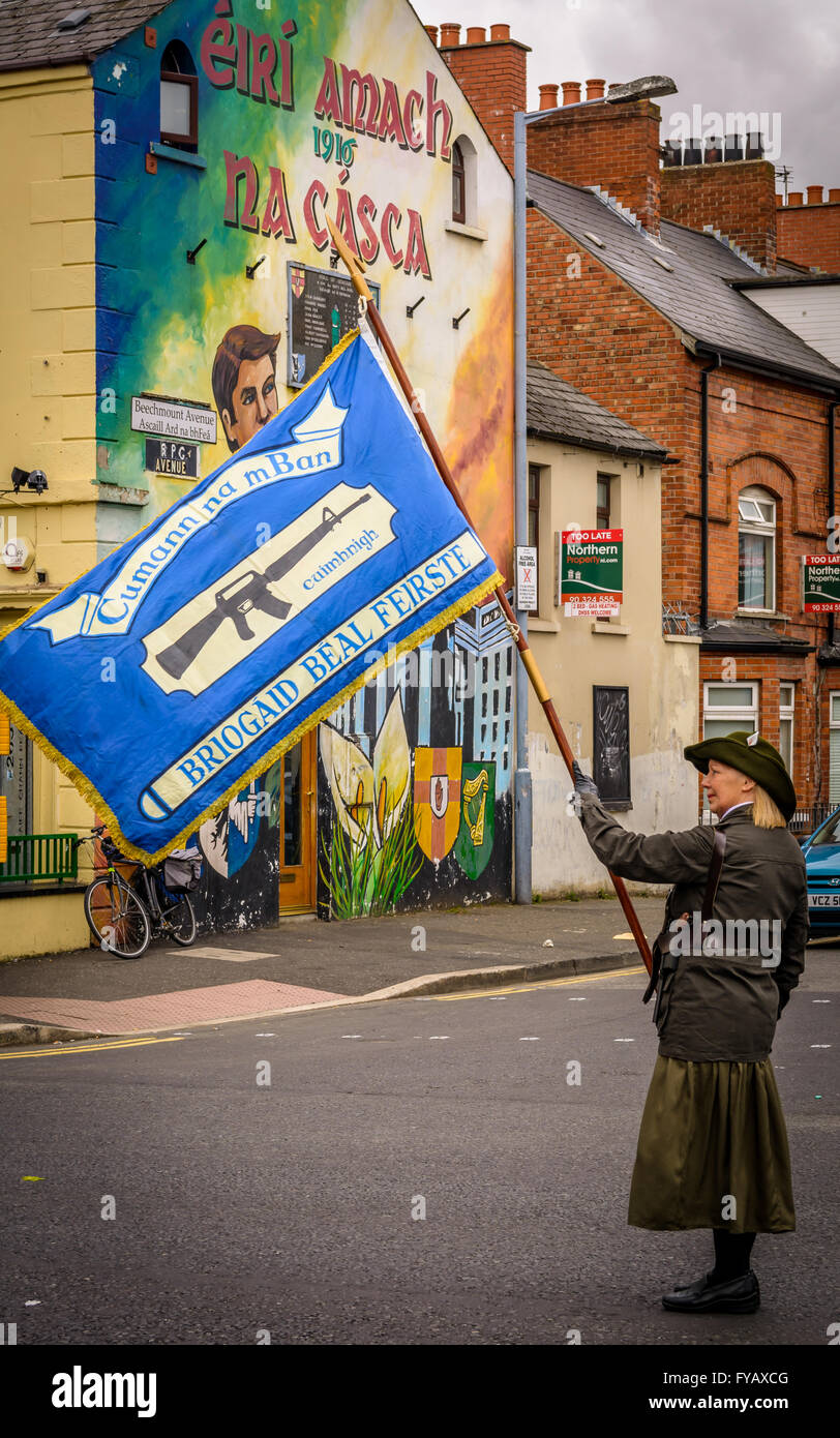 Female Irish Republican carrying Cumann na mBan flag on Belfast Falls ...