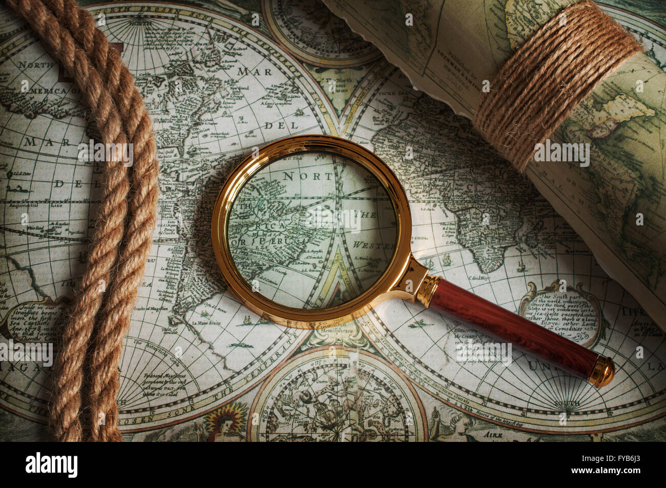 Vintage magnifying glass and rope on the background of old maps Stock ...