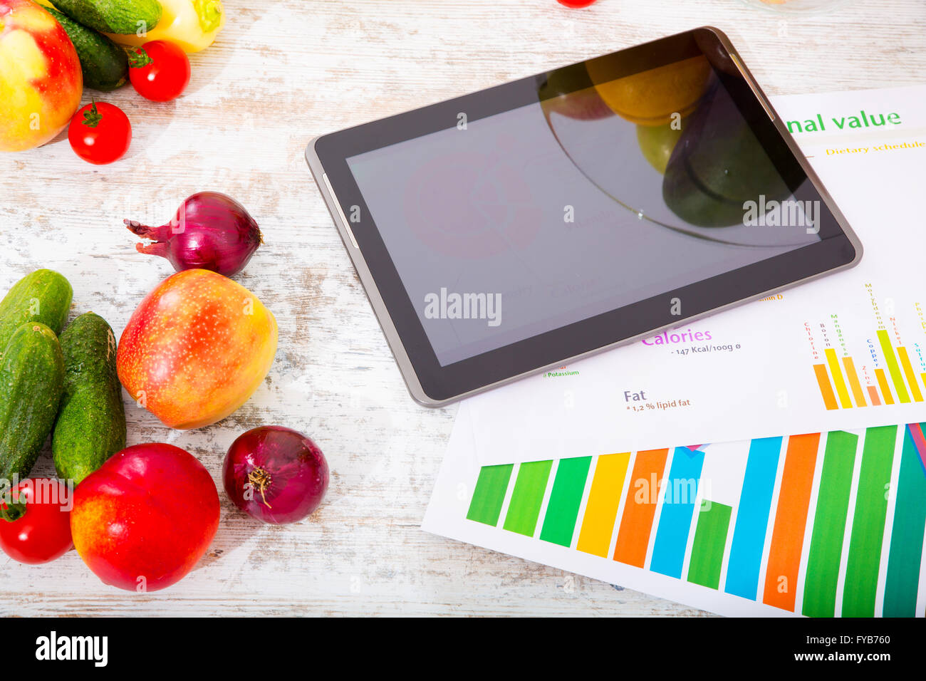 Organic fruit and vegetable on the table with a tablet PC Stock Photo ...
