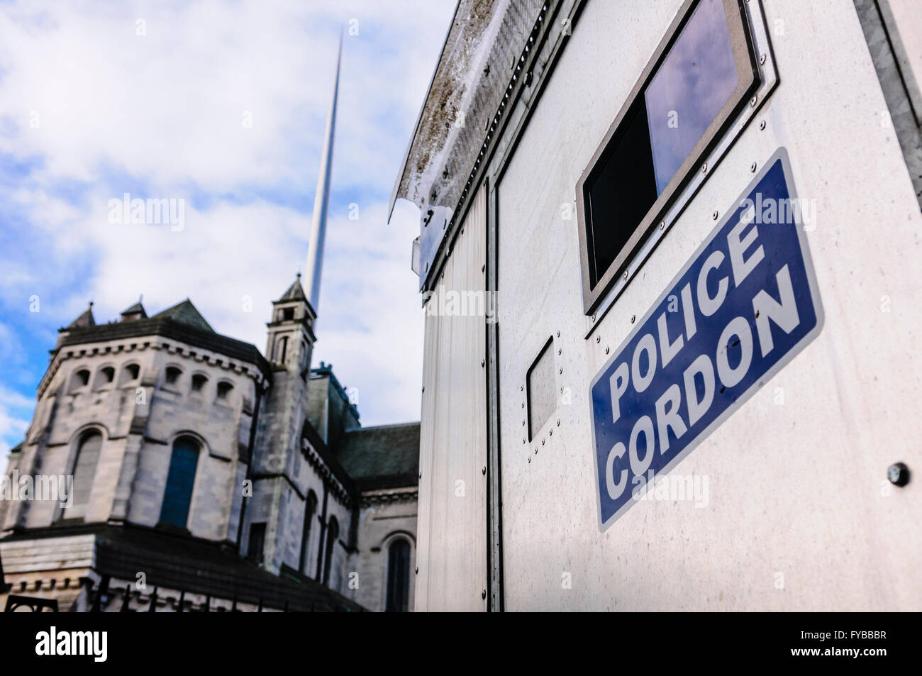 A police cordon barrier blocks off the street behind Saint Anne's ...
