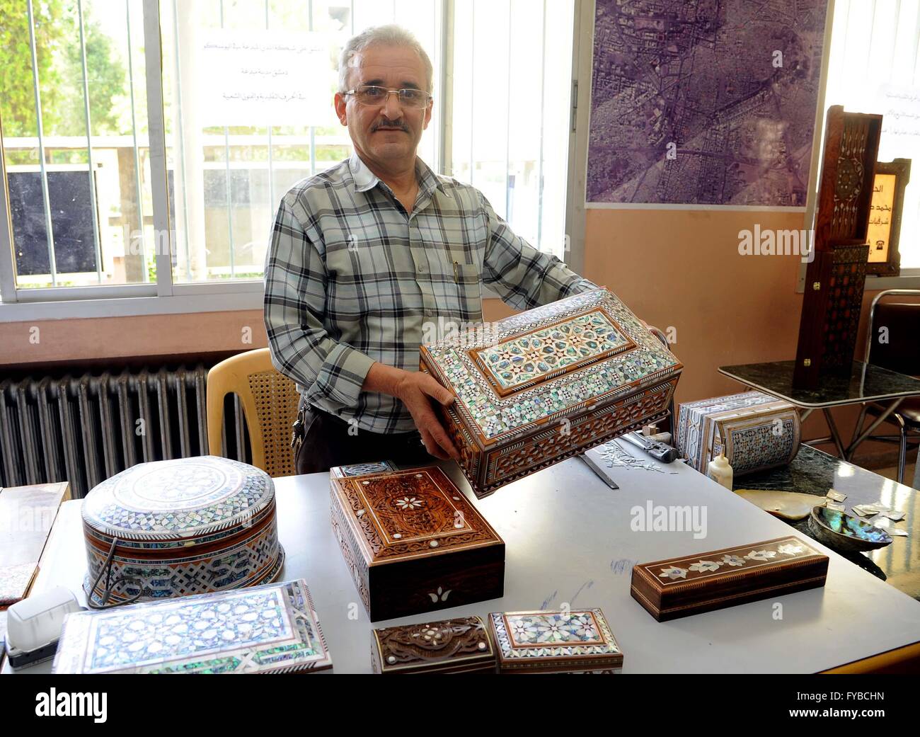 Damascus, Syria. 24th Apr, 2016. Yahia Nameh shows a Syrian jewelry box ...