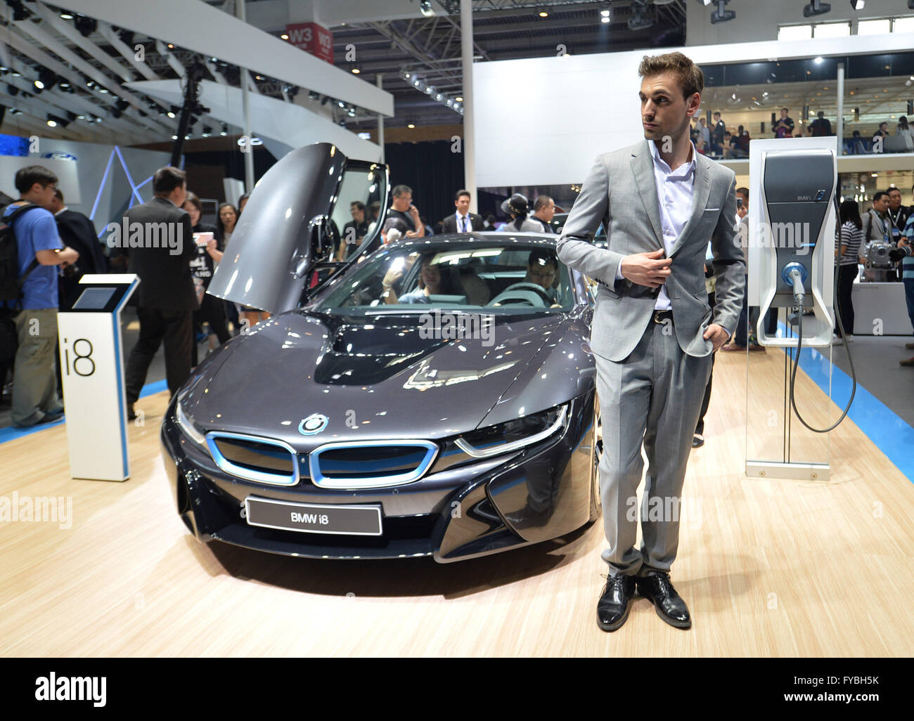 Beijing, China. 25th Apr, 2016. A model stands in front of a BMW ...