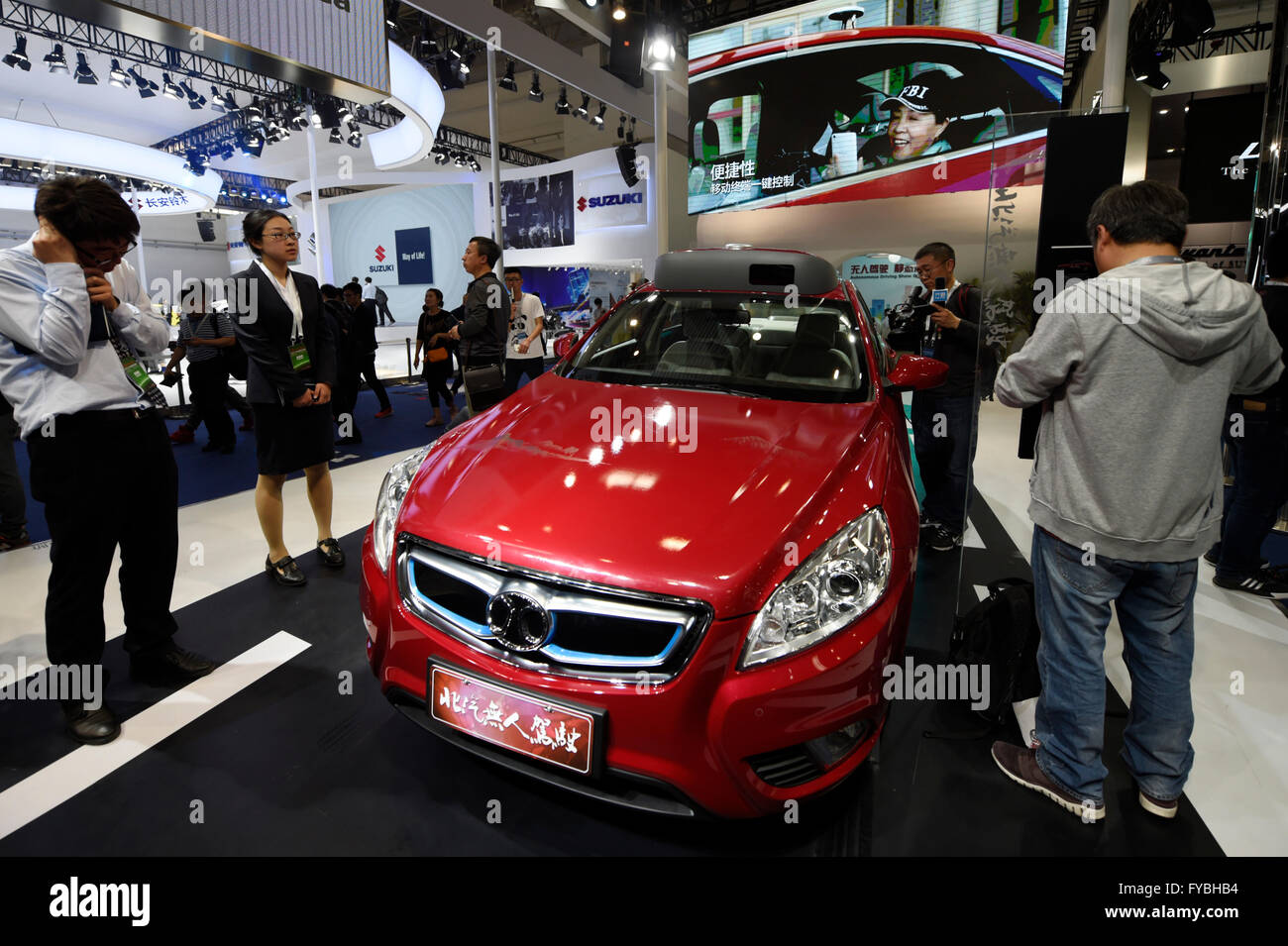 Beijing, China. 25th Apr, 2016. Visitors watch a driverless electric ...