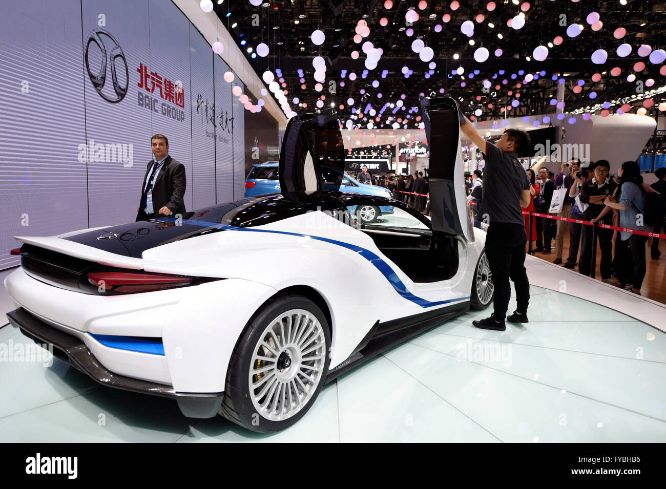 Beijing, China. 25th Apr, 2016. Visitors watch an electric race car of ...