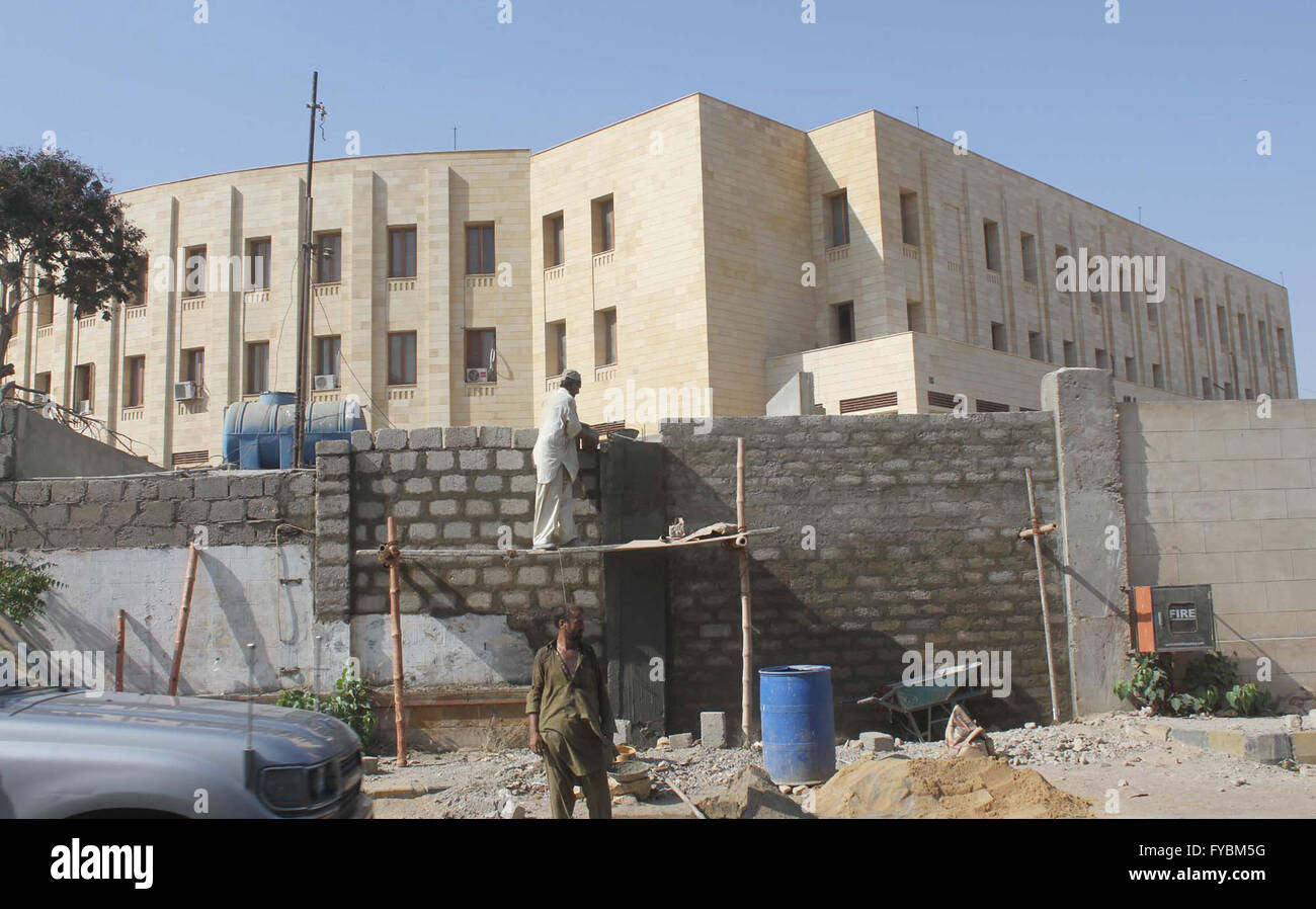 Laborer busy in construction of wall around Sindh Assembly in Karachi ...