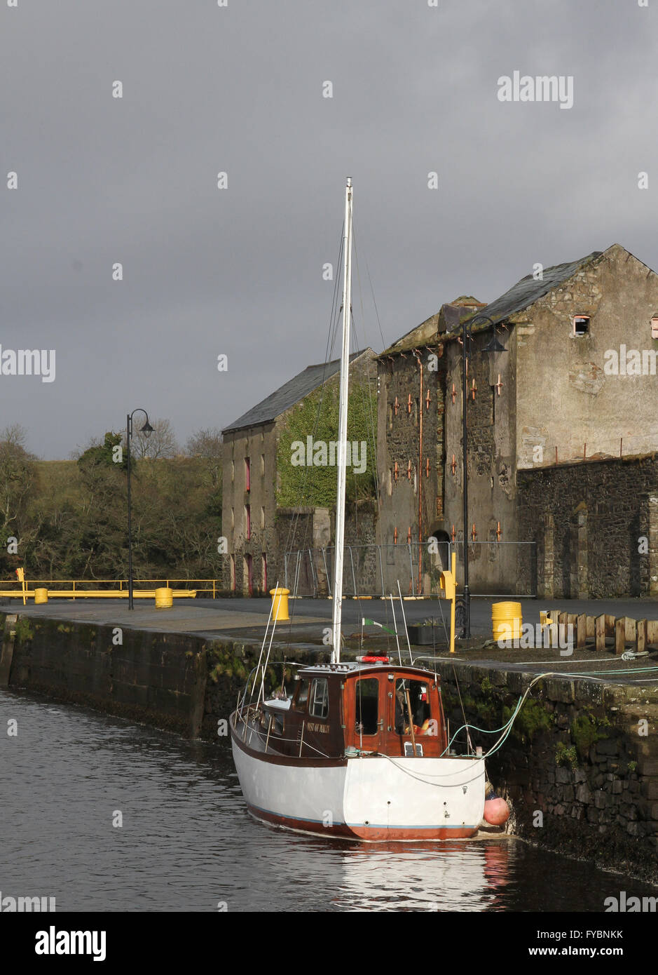 Old store building on the quayside at Ramelton County Donegal. The boat ...