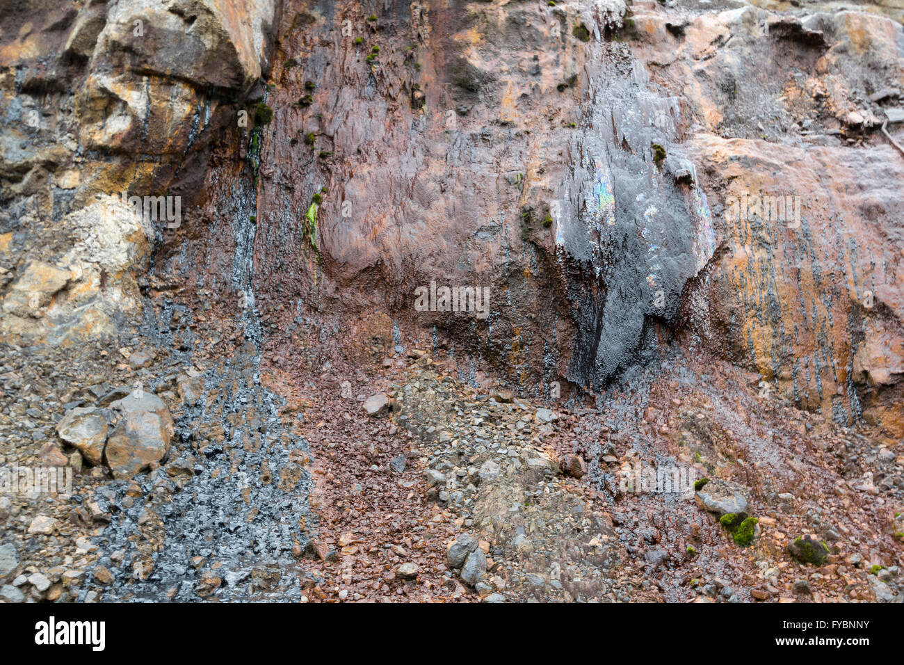 Crude oil seeping out of a rock face in an old quarry in Napo Province ...