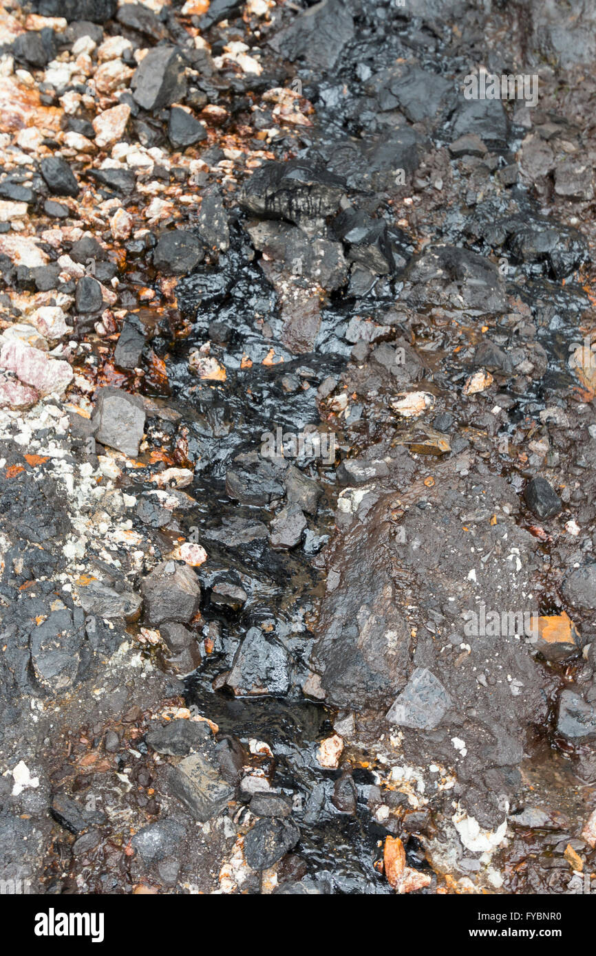 Bitumen seeping out of oil bearing rocks in an old quarry in Napo ...