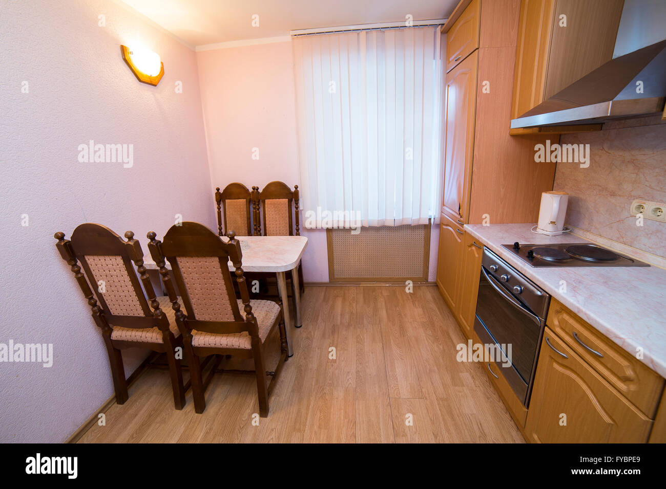 Nice Kitchen interior with wooden chairs Stock Photo - Alamy