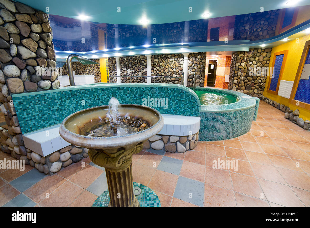 Swimming pool indoor with fountain Stock Photo - Alamy
