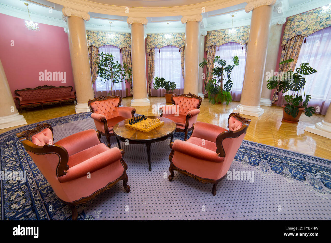 Luxury classic round hall with columns, chess desk and classic wooden ...