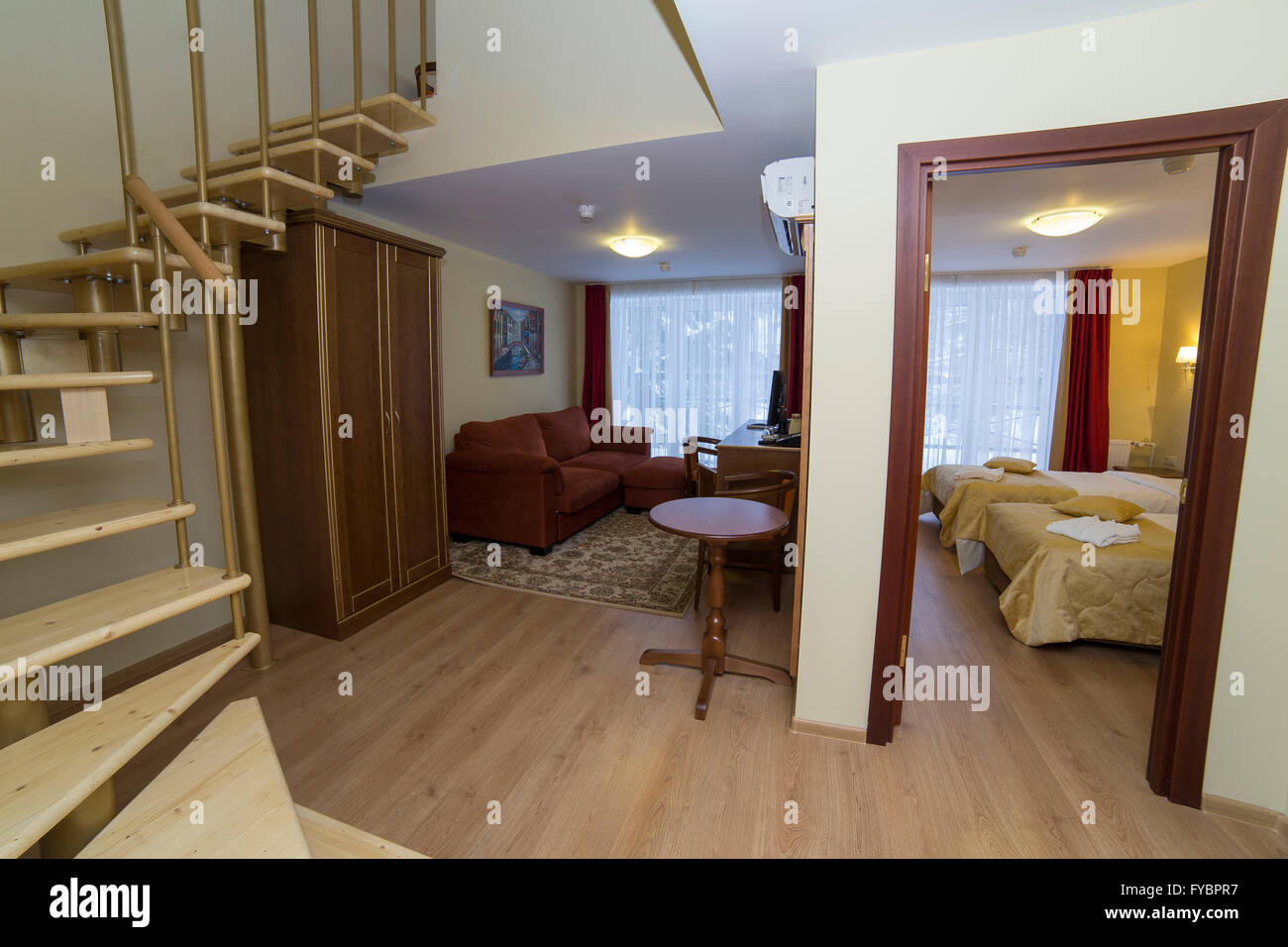 Hotel apartments interior with staircase Stock Photo - Alamy