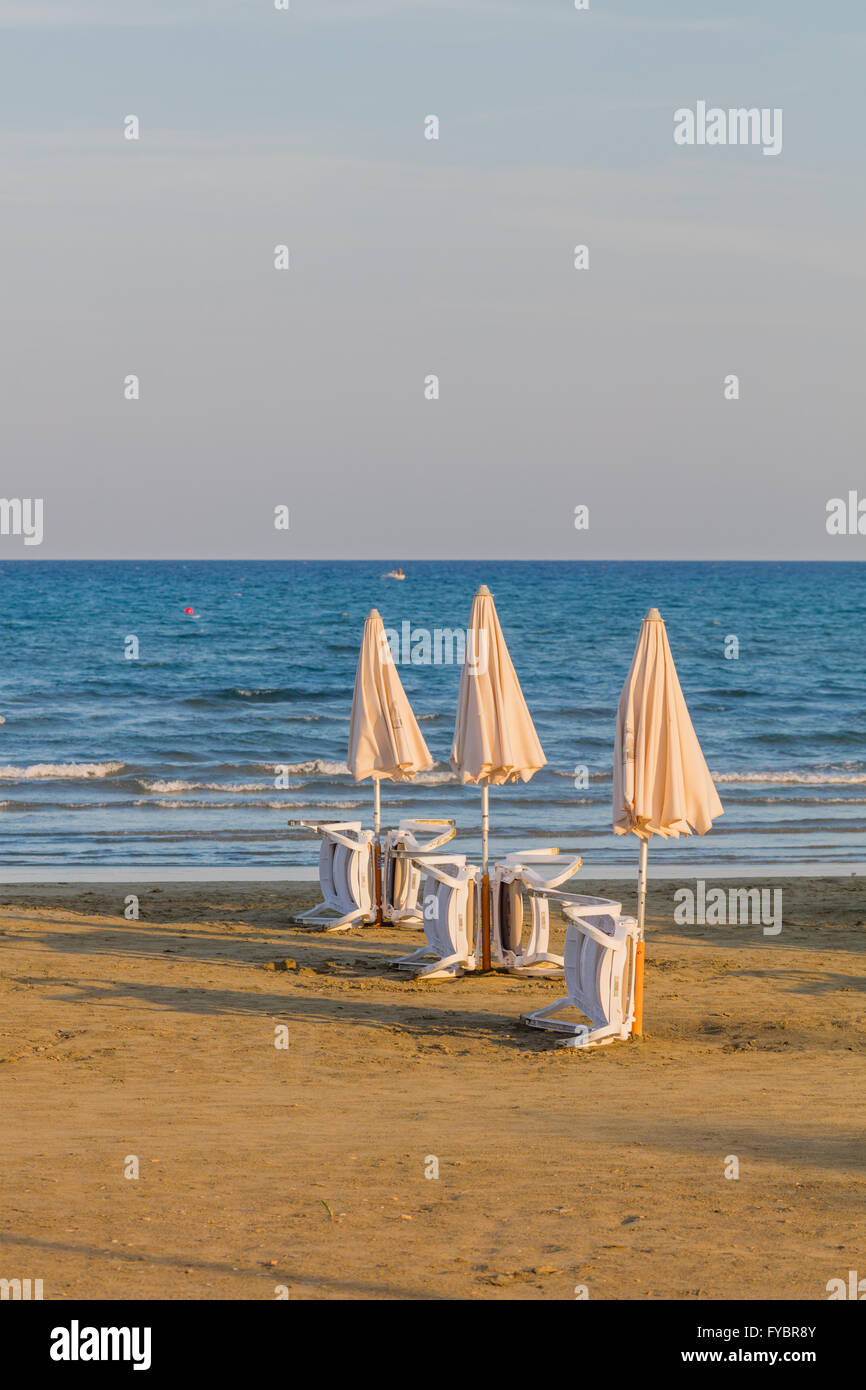 Mediterranean sea beach umbrellas on sand beach, Larnaca, Cyprus Stock ...