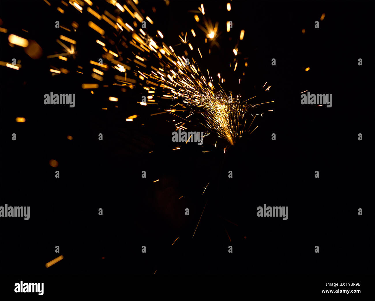 Sparks in the dark from a working grinding machine Stock Photo - Alamy