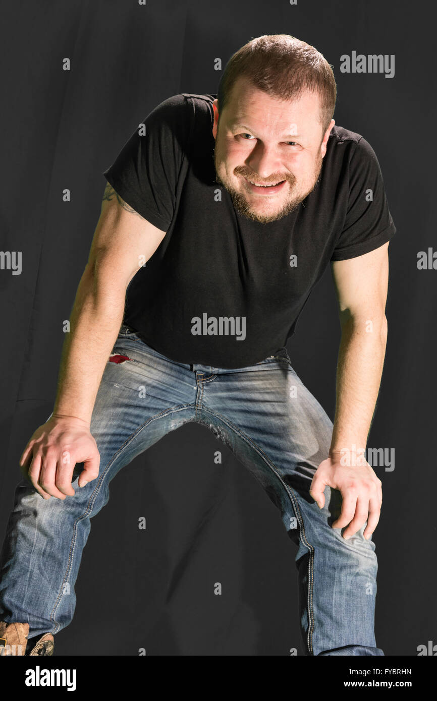 Portrait of a bully ready to fight on black background Stock Photo - Alamy