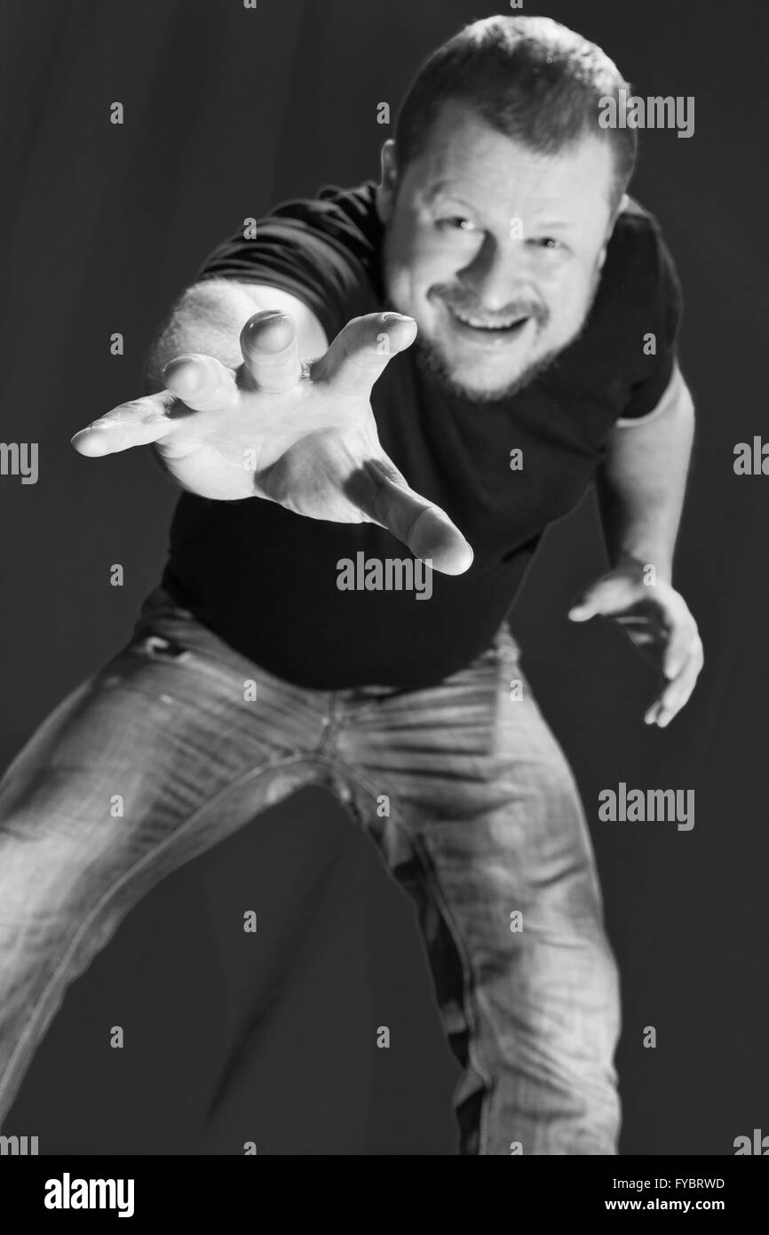 Emotional portrait of agressive bully fighting on black background ...