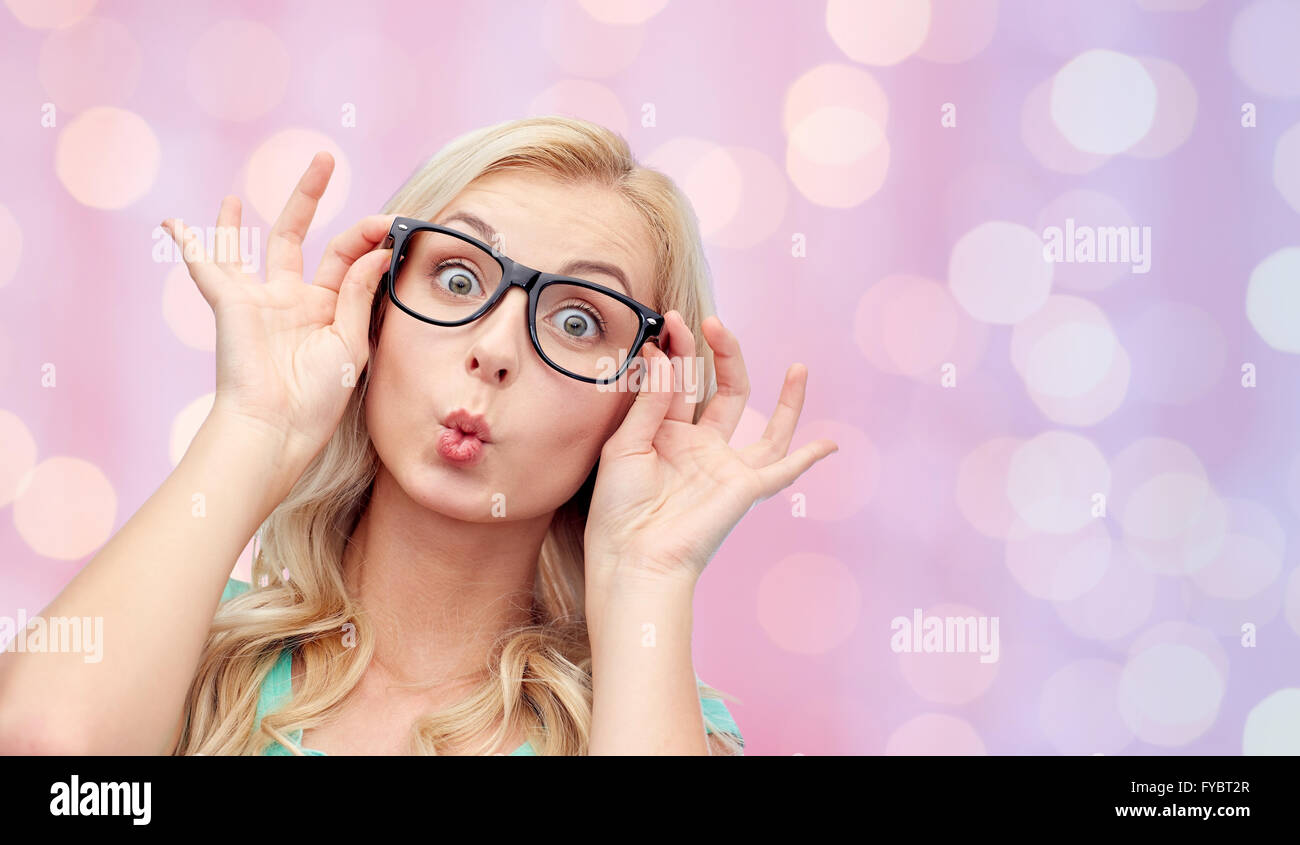 happy young woman in glasses making fish face Stock Photo - Alamy